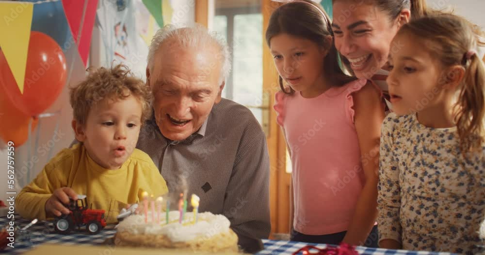 Portrait of a Small Family Gathering Around a Birthday Cake to Blow Out ...