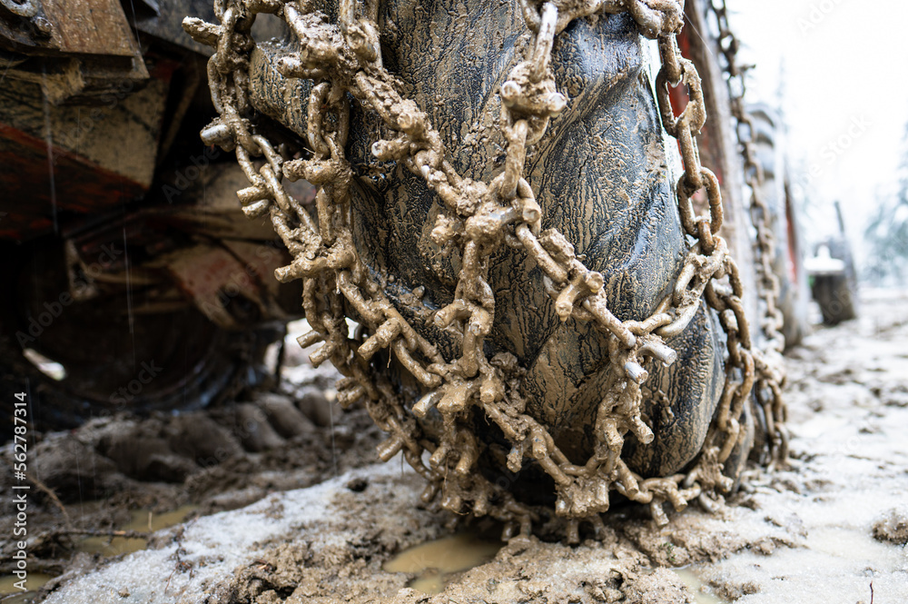 Close-up for extreme big off road 4x4 vehicle wheel with a snow and mud ...