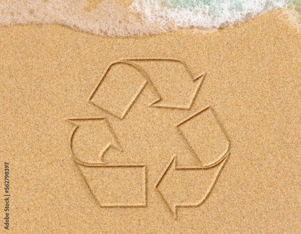 Logo of recycling drawing on sand on seashore. Concept of water ...