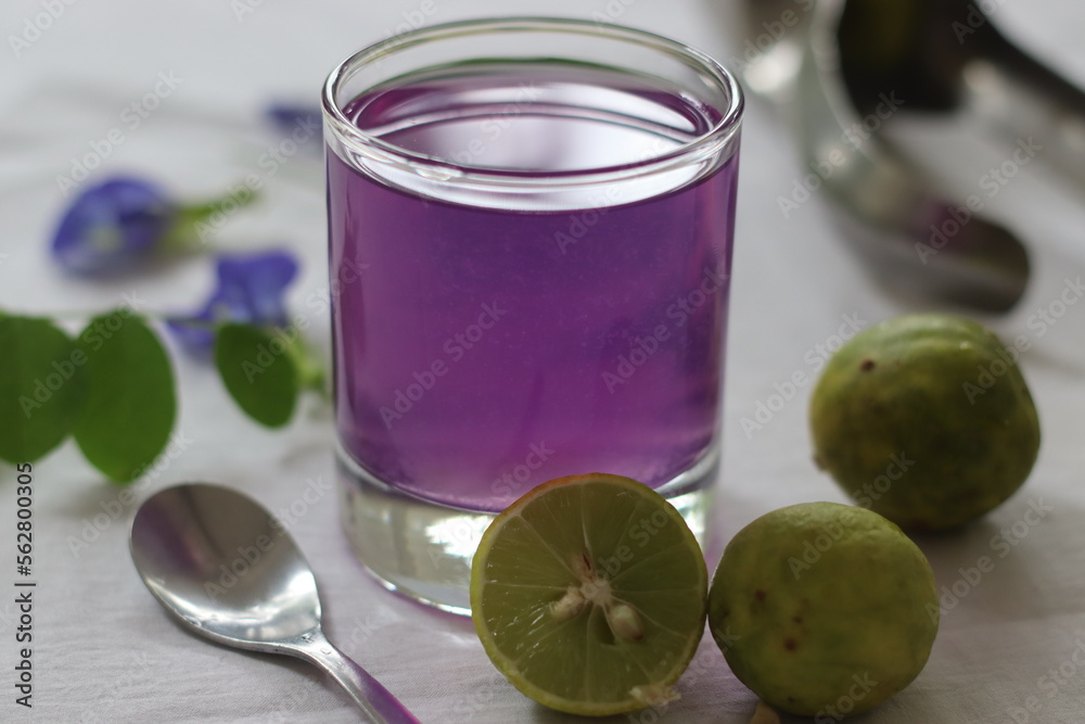 Pink coloured butterfly pea flower tea. Blue colored butterfly pea ...