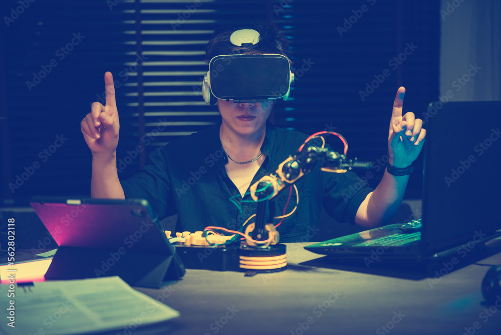 Young adult asian lesbian woman with short hair wearing VR box for ...