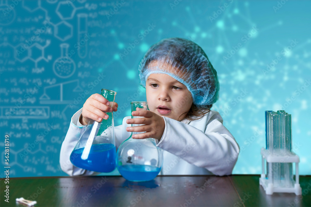 Little kid doing experiments with blue liquid. Cute child wants to ...