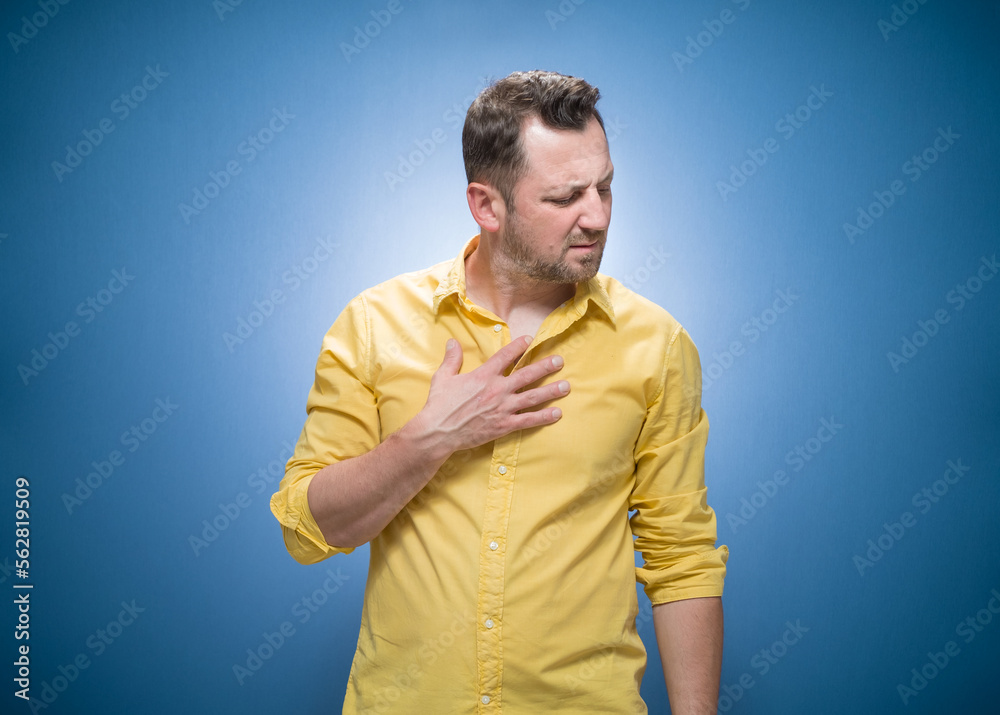 Half length man suffering from breathing problem over blue background ...