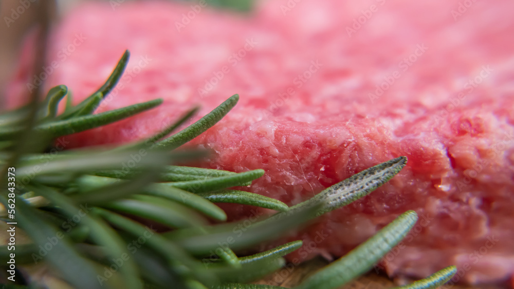 Extra close up Photo with rosemary and minced meat for cutlets. Macro ...