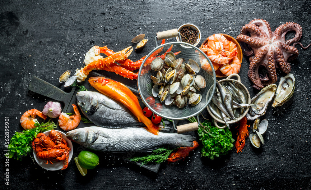Seafood. Fresh fish with oysters in colander, crab, octopus, shrimp and ...