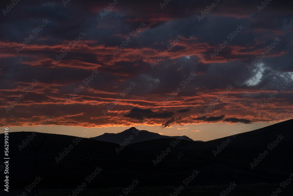 sunset view and cloudy sky with dramatic clouds, sunset over mountains ...