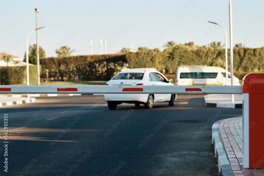 Checkpoint with security and automatic barrier on street. Guarded ...