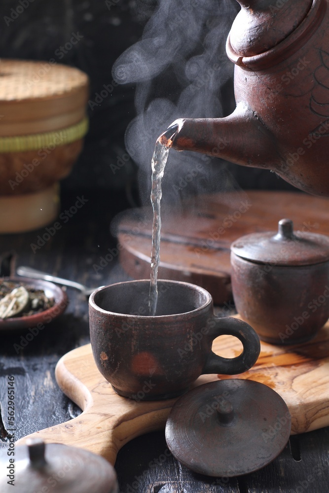 Tea is an aromatic beverage prepared by pouring hot or boiling water ...