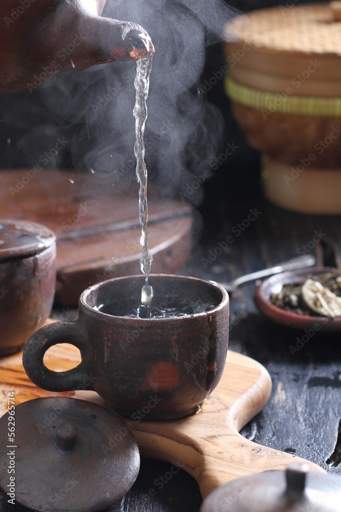 Tea is an aromatic beverage prepared by pouring hot or boiling water ...