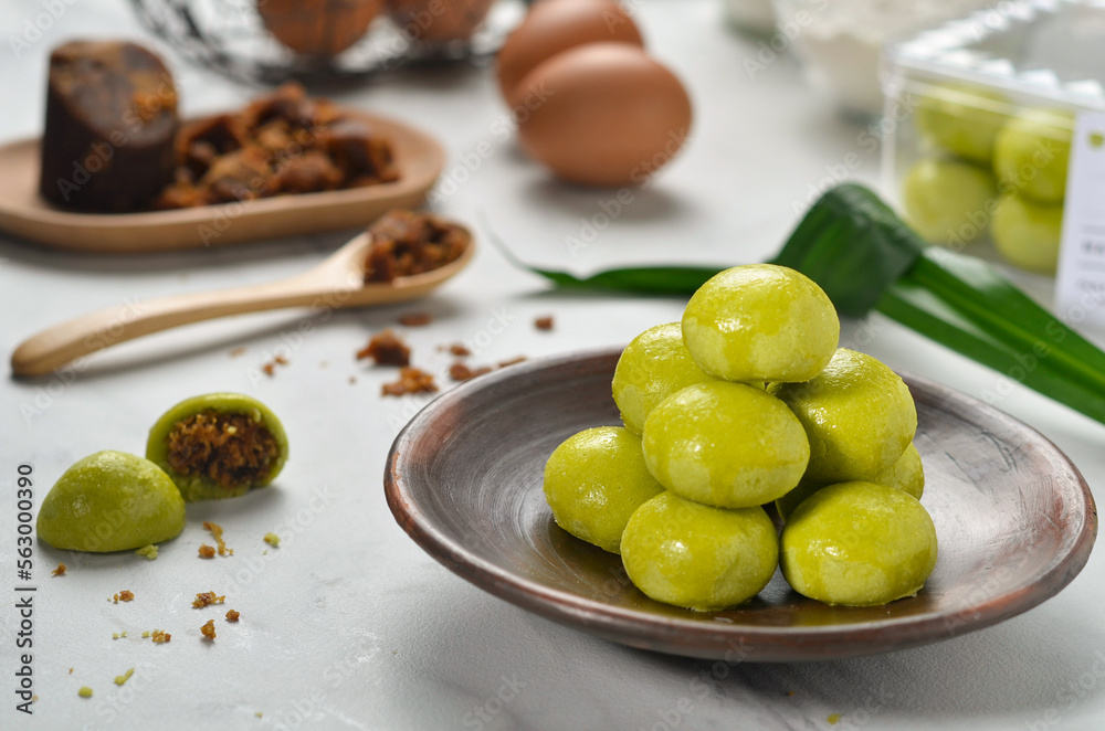 Klepon is a cookies of sweet balls filled with molten palm sugar and ...