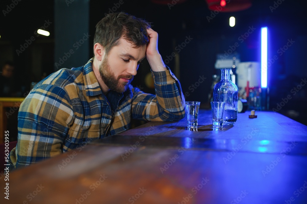 Sad man sitting at bar counter, alcohol addiction Stock Photo | Adobe Stock