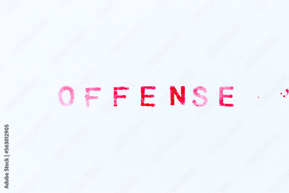 Red color ink rubber stamp in word offense on white paper background ...
