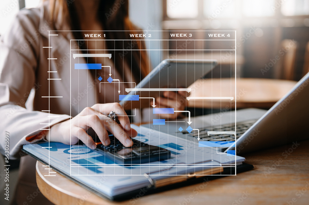 Project manager working and update tasks with milestones progress ...