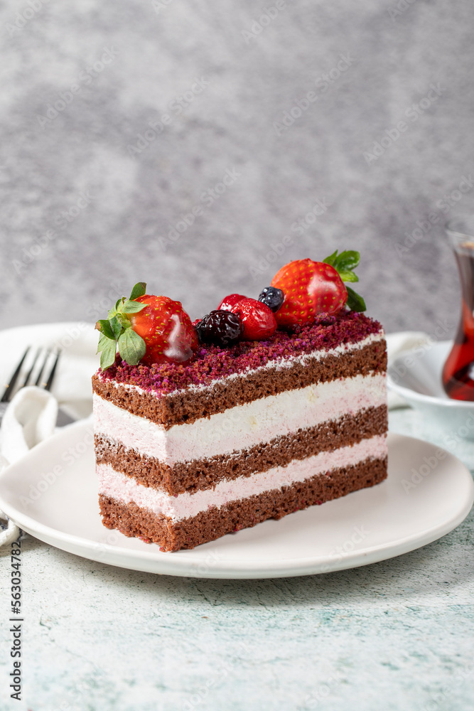 Fruit and whipped cream cake. Layered cake with forest fruit and cream ...