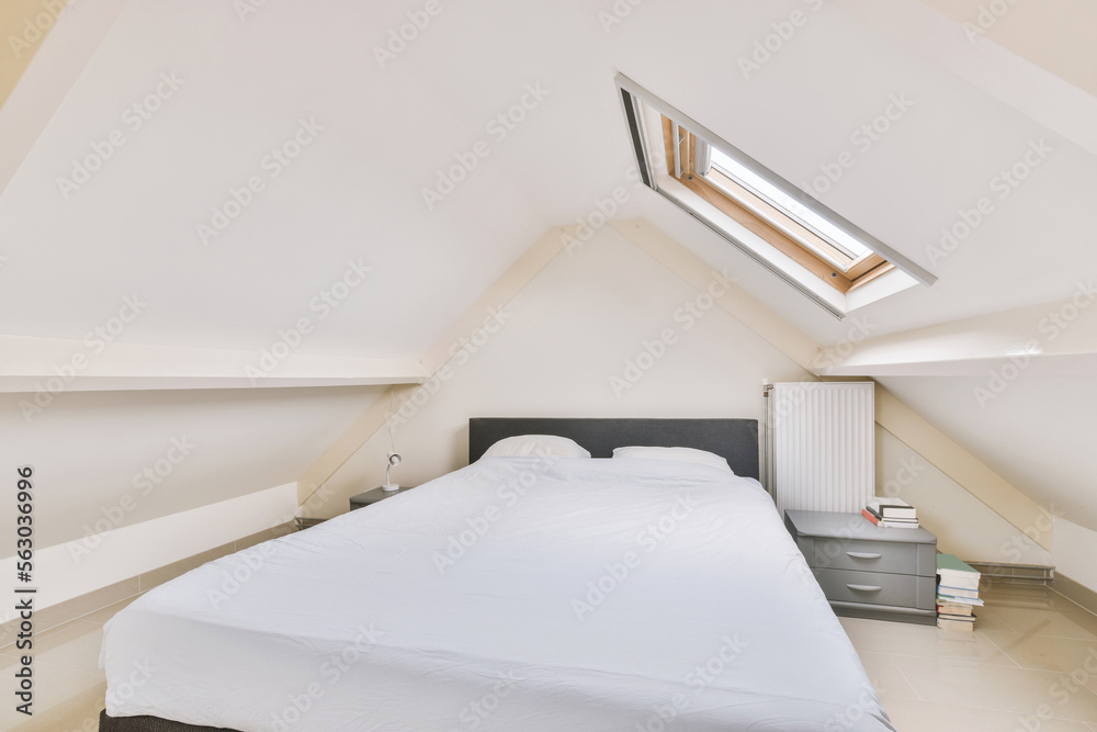 Modern bedroom with triangle shaped ceiling Stock Photo | Adobe Stock