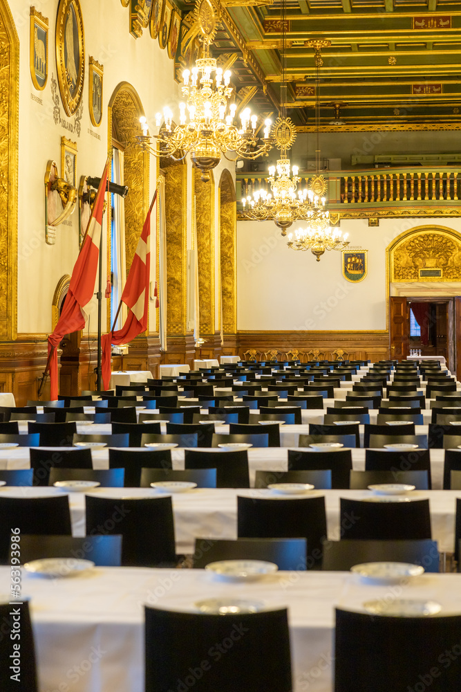 Copenhagen, Denmark A large reception room and place settings in a ...