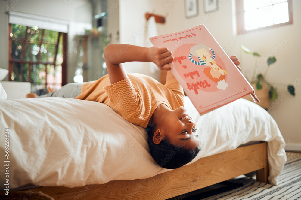 Happy child reading book on bed for home learning, language education ...