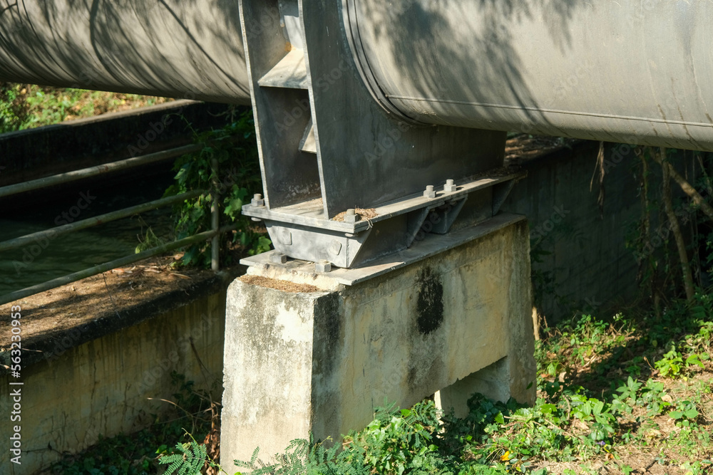 Pipe is installed along the bridge on the pipe support. Water steel ...