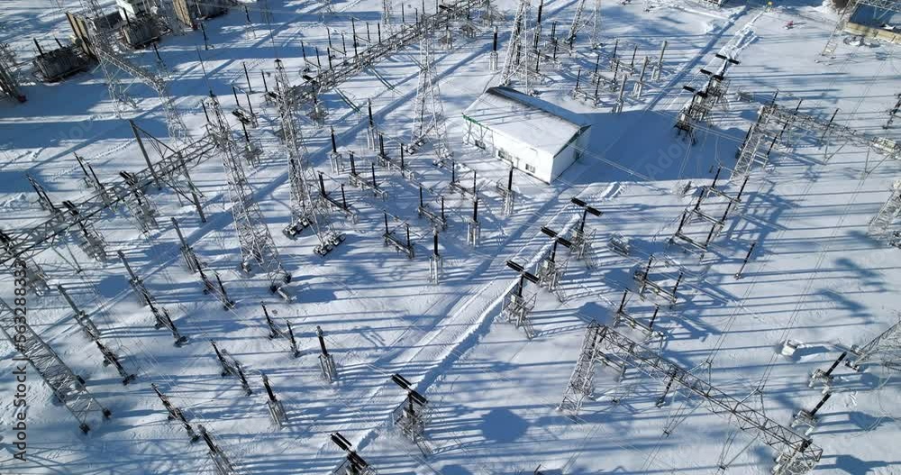 Top view of an Electrical Substation in winter with high pylons and ...