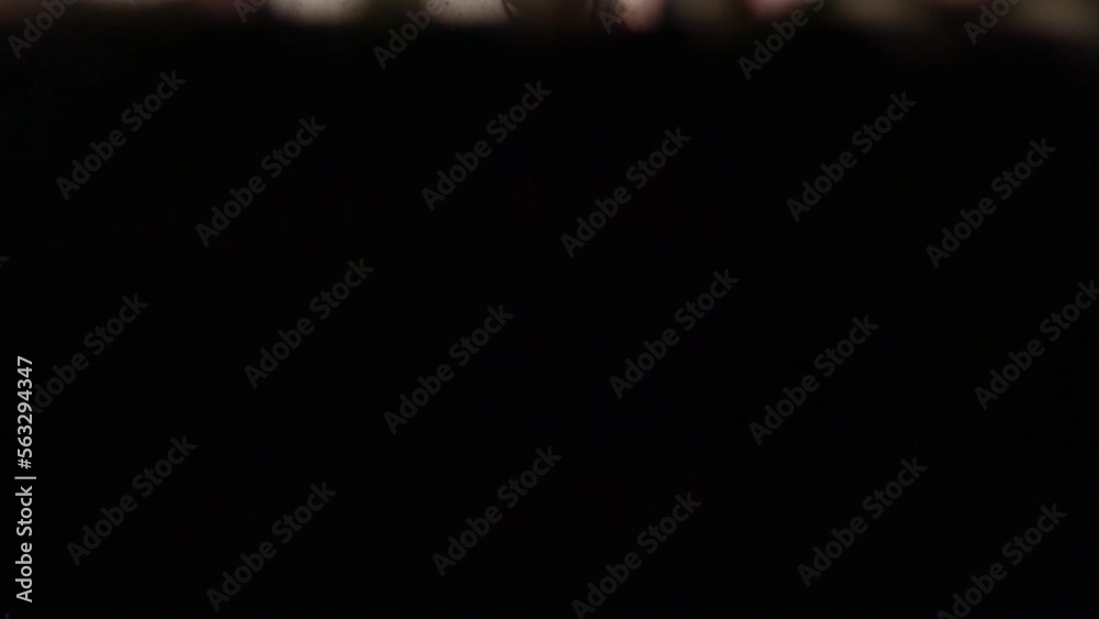 POV cinematic shot maniac in black clothes with rope in hands strangling his victim in a ...