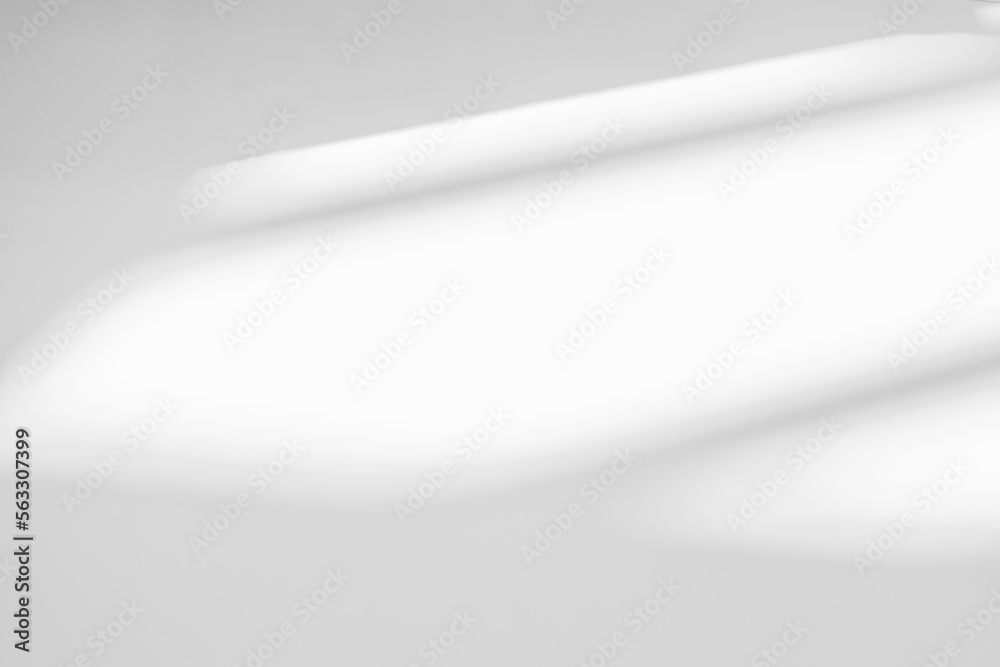 Abstract light reflection and grey shadow from window on white wall ...