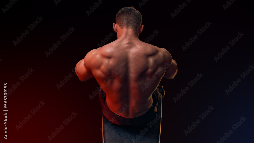 Foto de Unrecognizable bodybuilder trains abdominal muscles on a bench ...