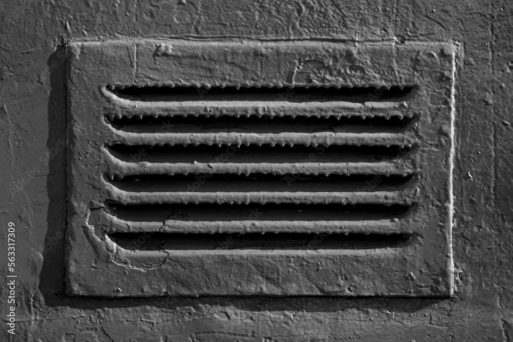 Industrial ventilation grill. The ventilation grille is sloppily ...