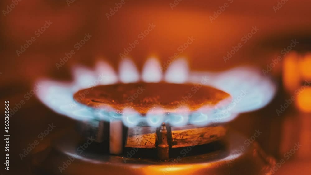Stockvideon Ignite the gas on the stove with a matchstick, close-up ...