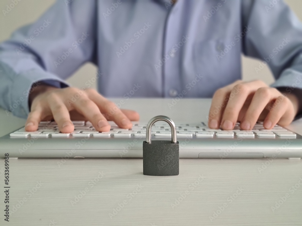 Programmer student types code on keyboard and protect cyber security ...