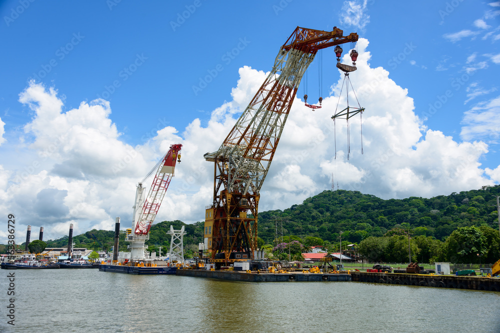 Titan Herman the German dwarfs the Huisman crane on the Panama canal ...