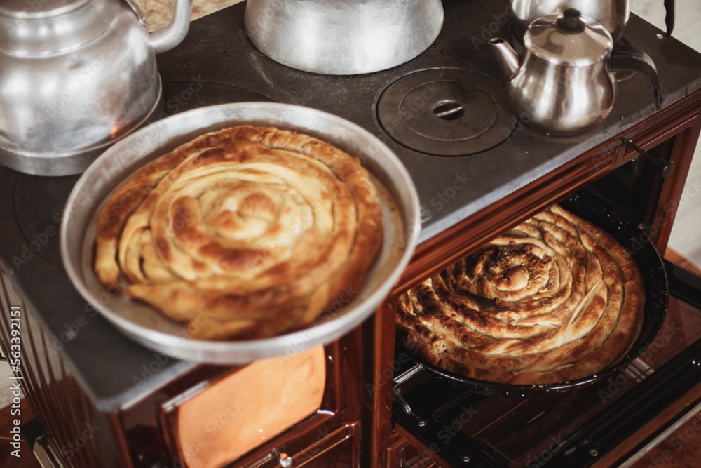 Foto de Roll pastry cooked in a wood stove. Title: on a white ...