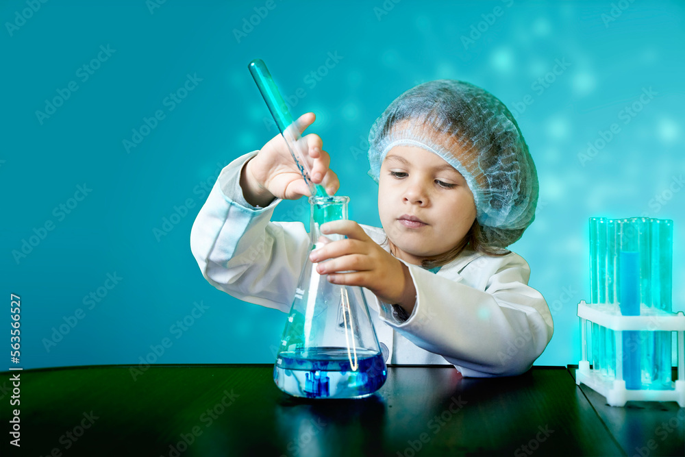 Little kid doing experiments with blue liquid. Cute child wants to ...