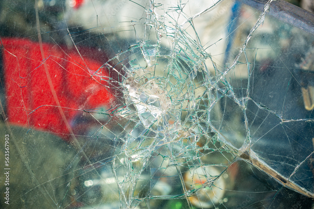 Broken car windshield. The car got a big hole in the windshield, an ...