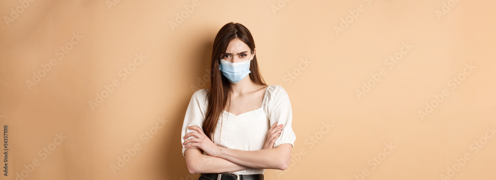 Covid-19 and lifestyle concept. Angry woman look with despise, wearing ...