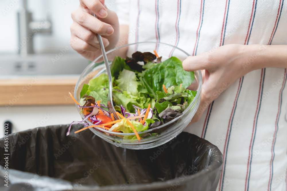 Food waste environment concept, people throwing food garbage into bin ...