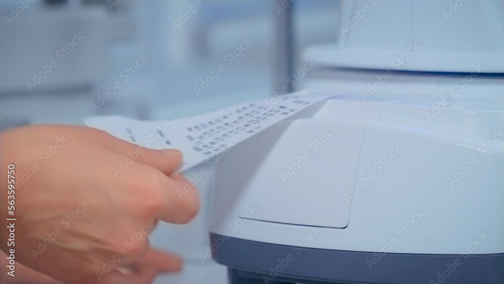 Medical results printout in ophthalmology clinic. Printing medicine ...