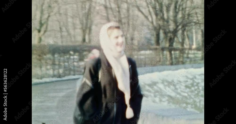 Woman walking street outdoors in lens flare. 1980s Kyiv, Ukraine. Happy ...