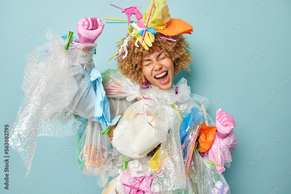 Positive female volunteer feels like winner makes yes gesture clenches ...