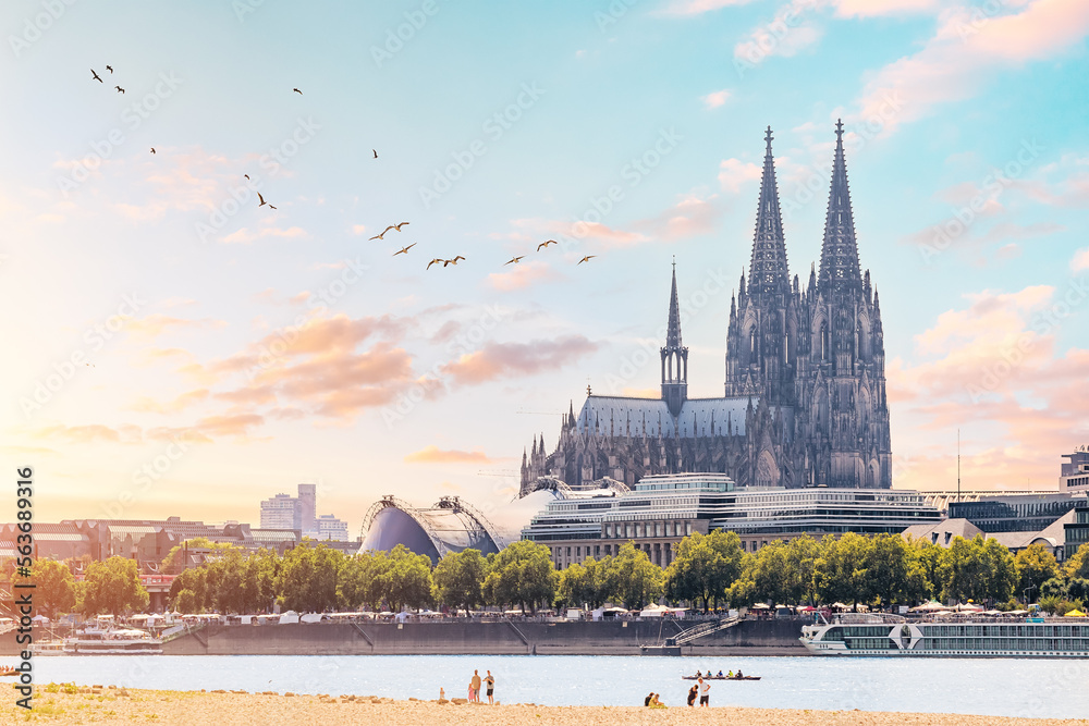 Scenic view of the Rhine River beach and the Cologne skyline with ...