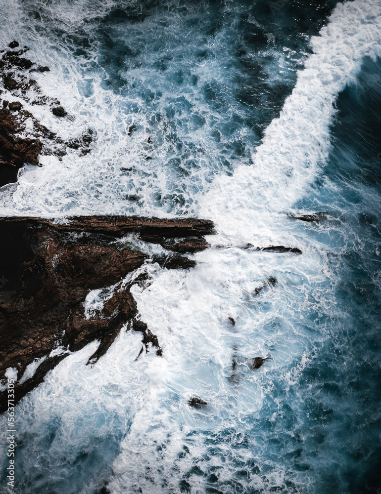 Vertical Aerial photo of strong and powerful ocean with huge waves ...
