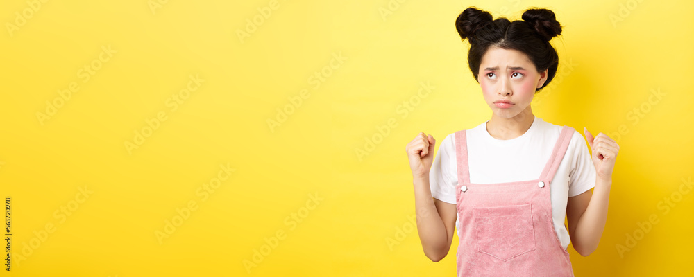 Timid angry girl sulking and clenching teeth, feeling mad but looking ...