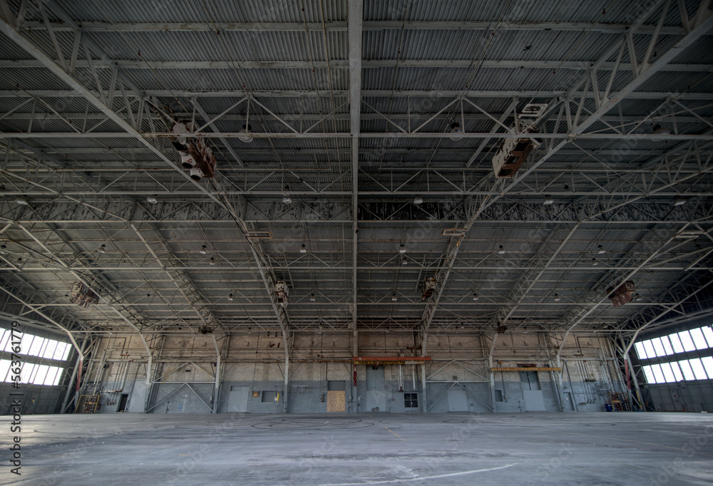 Abandoned airplane hanger with large, steel rafters and trusses Stock ...