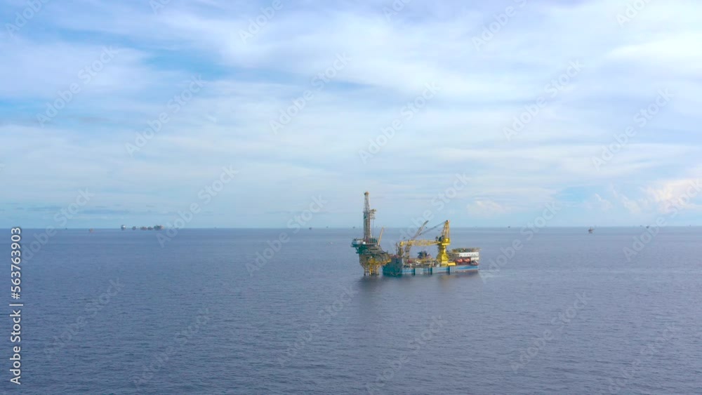 An aerial view from a drone of a tender drilling oil rig (Barge Oil Rig ...