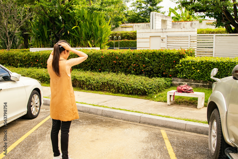 Concept lost car : Rear view Confused and sad Asian woman standing ...