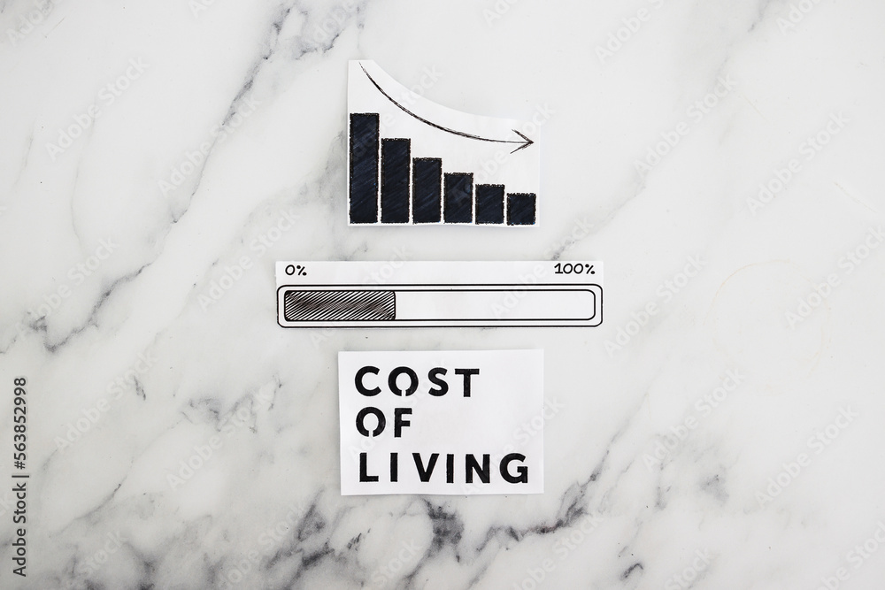 cost of living going down, text with graph showing stats decreasing and ...