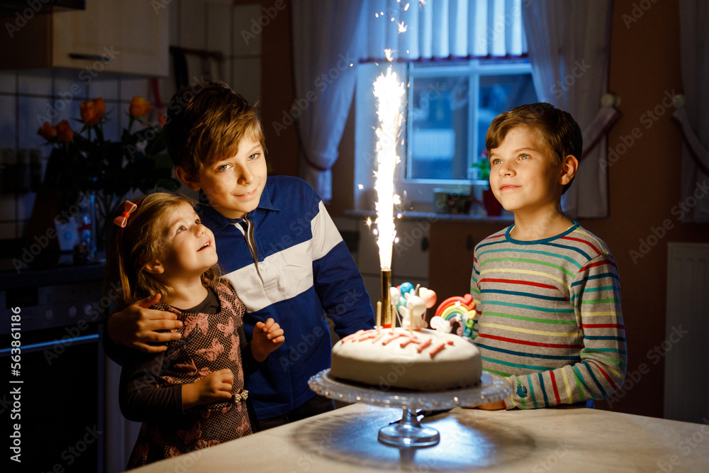 Adorable little toddler girl celebrating third birthday. Baby sister ...