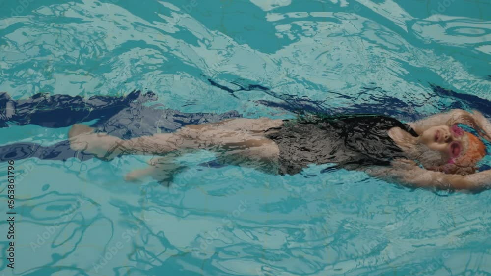 Beautiful Little Girl Learns To Swim Backstroke Style. Child Training ...