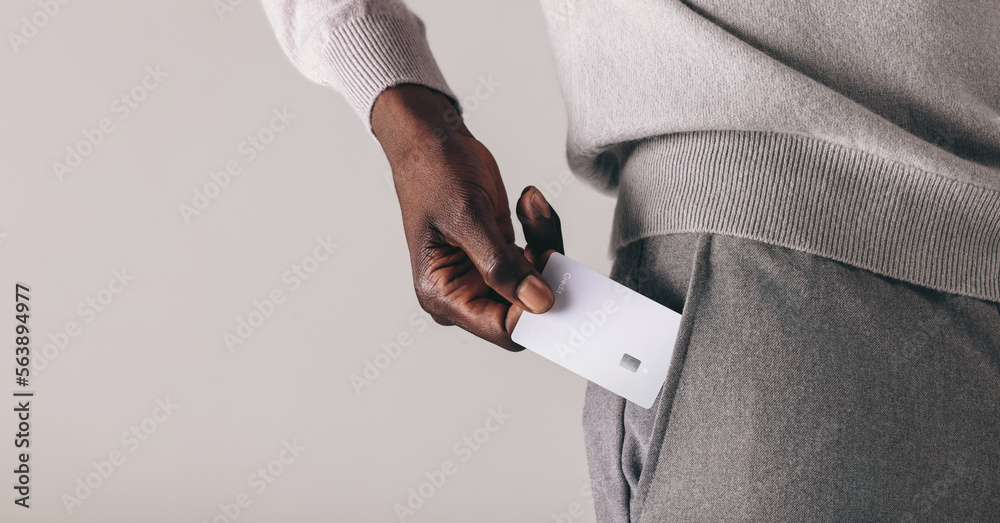 Professional man with a premium bank account puts his credit card into ...