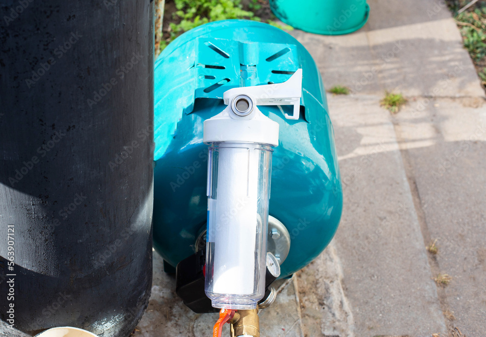 The system of modern water supply in a country house from a well source ...