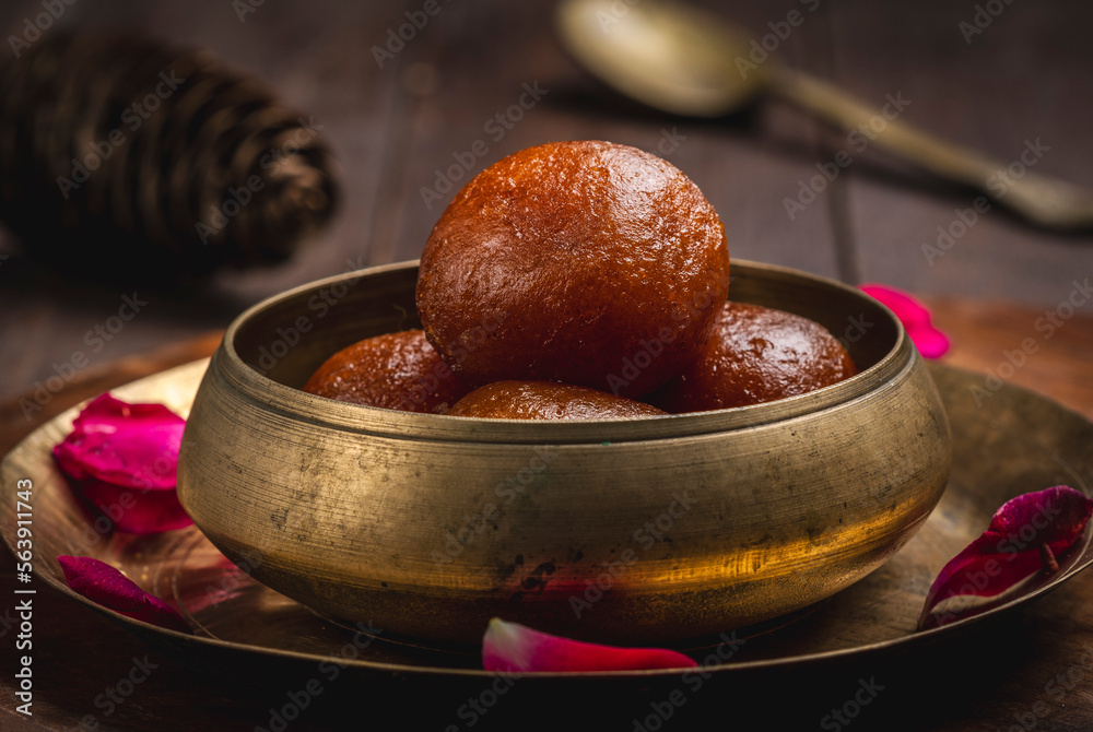 Gulab jamun is made with deep-fried balls of milk base dough soaked in ...